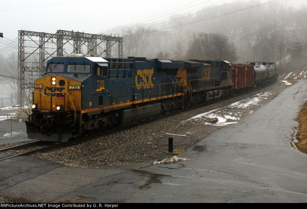 CSX power on westbound oil empties, K08103, on a damp foggy March morning.